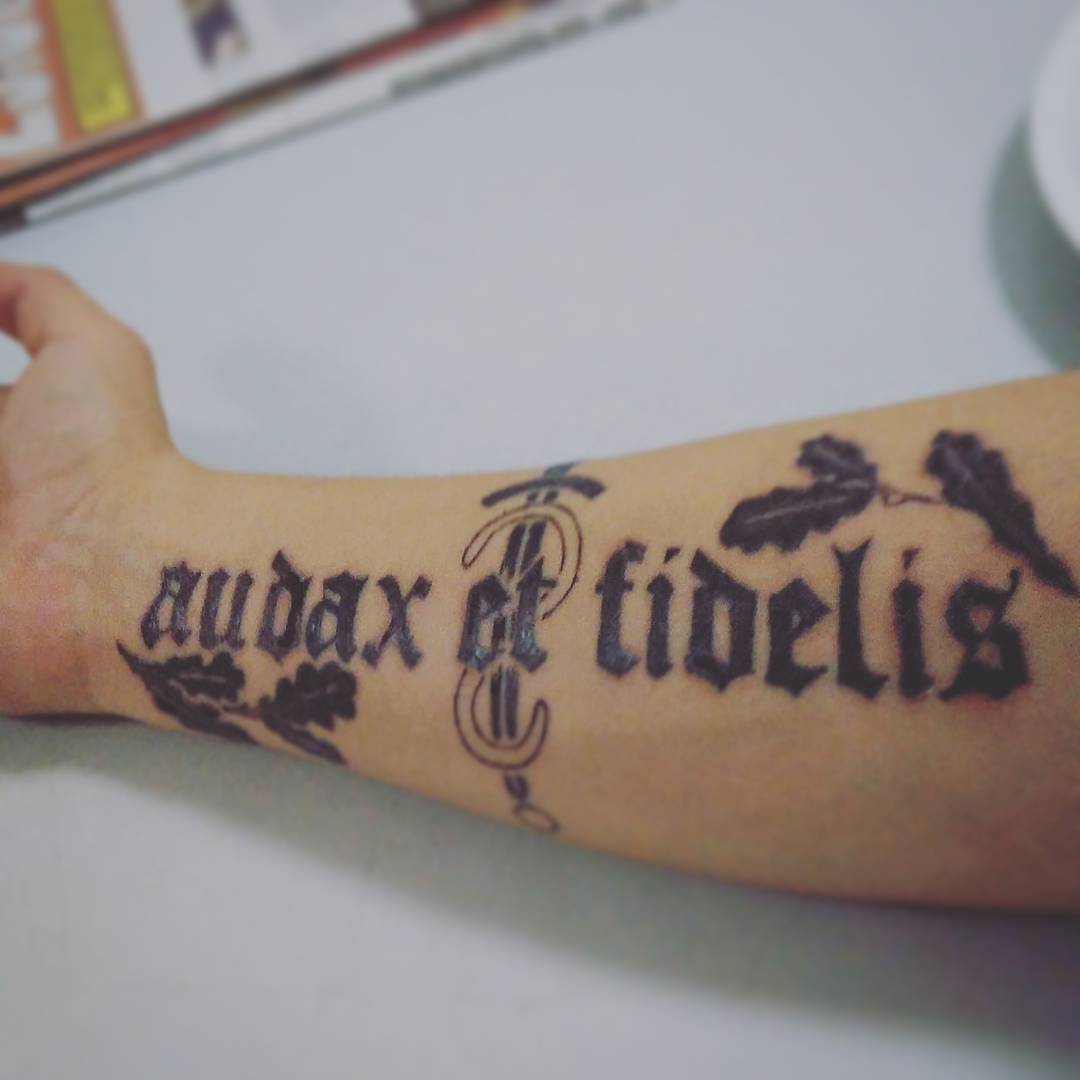 What Do Latin Phrase Tattoos Mean And Where Did They Come From?