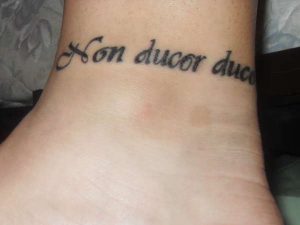 What Do Latin Phrase Tattoos Mean And Where Did They Come From?